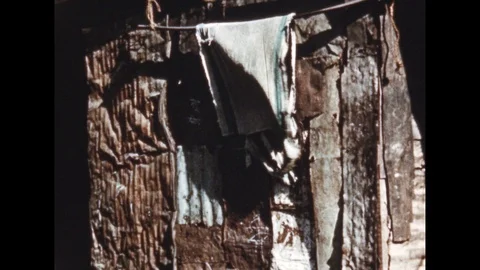 1950s: Slums. Clothesline. People in s... | Stock Video | Pond5
