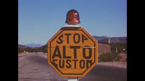 1950s: Stop sign in English and Spanish.... | Stock Video | Pond5