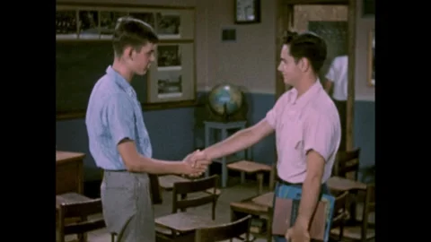 1950s: Students exit classroom. Boy appr... | Stock Video | Pond5