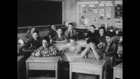 1950s: Students sit in classroom. Boys ... | Stock Video | Pond5