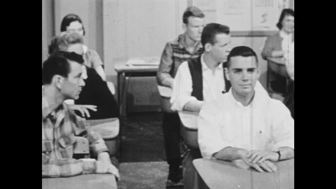 1950s: Students sit at desks in classroo... | Stock Video | Pond5