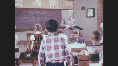 1950s: Teacher in classroom with childre... | Stock Video | Pond5