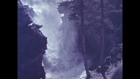 1950s: Tilt up waterfall. Pan across wat... | Stock Video | Pond5