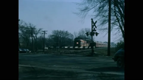 1950s: Train gate arm descends. Train sp... | Stock Video | Pond5
