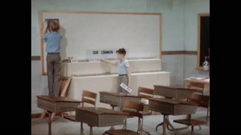 1950s: Two boys in classroom set up pres... | Stock Video | Pond5