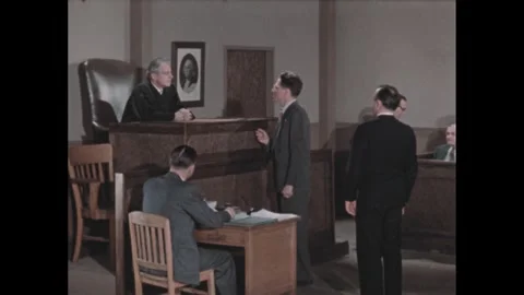 1950s: Two men stand before judge in cou... | Stock Video | Pond5