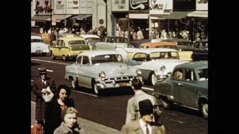 1950s: View of city street, cars driving... | Stock Video | Pond5