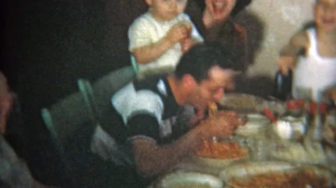 1951: Big family at crowded dinner table... | Stock Video | Pond5