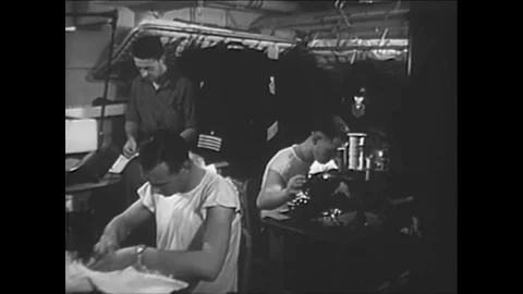 1952 - Men sew up torn uniforms and cobb... | Stock Video | Pond5