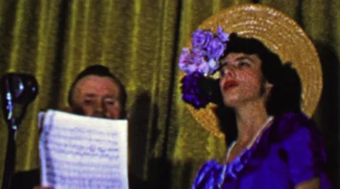 1957: Singing couple dramatically perfor... | Stock Video | Pond5
