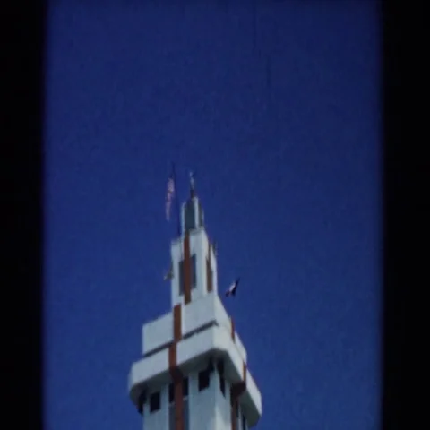 1958: a tall magnificent tower with flag... | Stock Video | Pond5
