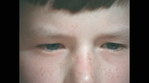1960s: boy blinking, boy's ear, boy lowe... | Stock Video | Pond5