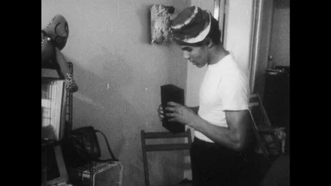 1960s: Boy looks at radio. Boy looks thr... | Stock Video | Pond5