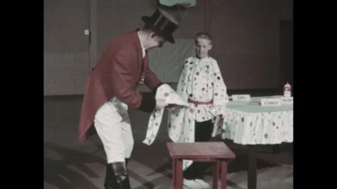 1960s: Boy stand next to table. Carnival... | Stock Video | Pond5