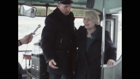 1960s: Bus driver helps woman onto bus. ... | Stock Video | Pond5