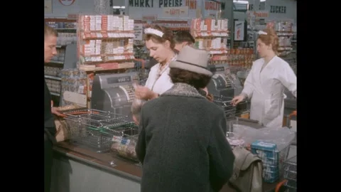 1960s: Cashiers check out customers at g... | Stock Video | Pond5