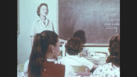 1960s: Classroom, female teacher stands ... | Stock Video | Pond5