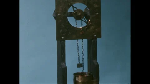 1960s: Clock. Hands turn and pendulum l... | Stock Video | Pond5