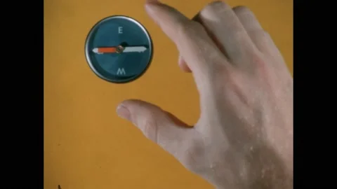 1960s: Compass on an orange background. ... | Stock Video | Pond5