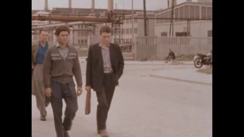 1960s: Factory. People walk down street... | Stock Video | Pond5