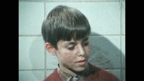 1960s: Film slate. Boy standing against ... | Stock Video | Pond5
