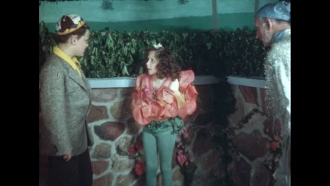 1960s: Girl in rose costume and boy have... | Stock Video | Pond5