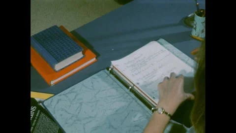 1960s: Girl takes pages out of her binde... | Stock Video | Pond5