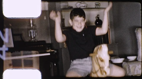 1960s Goofy Little Boy Rides Rocking Hor... | Stock Video | Pond5