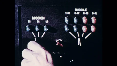 1960s: Hand turns control dial for missi... | Stock Video | Pond5