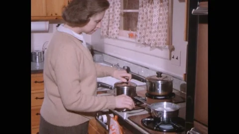 1960s: Hands with paper. Woman cooking o... | Stock Video | Pond5