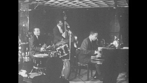 1960s: Jazz trio plays instruments on sm... | Stock Video | Pond5