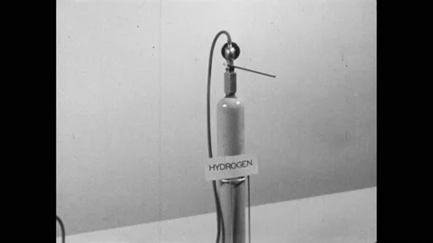 1960s: Lab, man holds helium gas tube, t... | Stock Video | Pond5