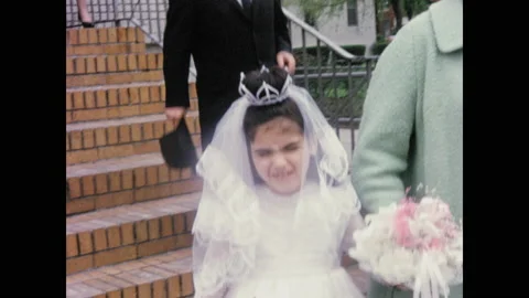 1960s: Little girl dressed in formal whi... | Stock Video | Pond5