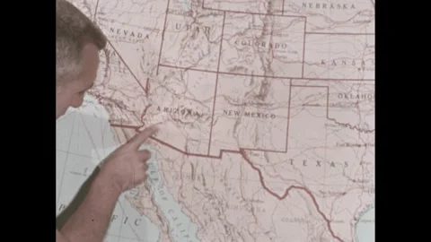 1960s: Man gestures at map of United Sta... | Stock Video | Pond5