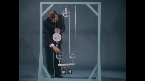 1960s: Man lifting weights using pulleys... | Stock Video | Pond5