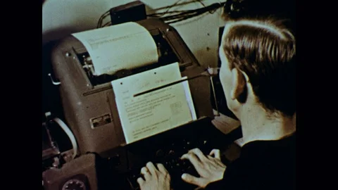 1960s: Man types at teletype machine. Ra... | Stock Video | Pond5