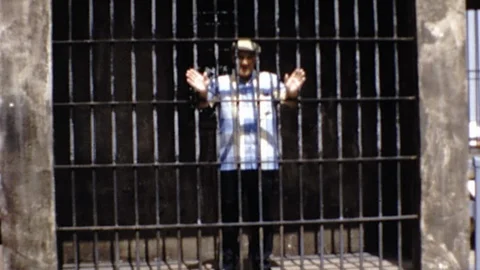 1960s Man Waves Hello From Jail Prison C... | Stock Video | Pond5