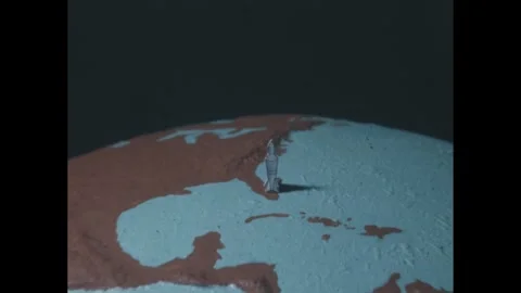 1960s: Model of rocket on globe, zoom in... | Stock Video | Pond5