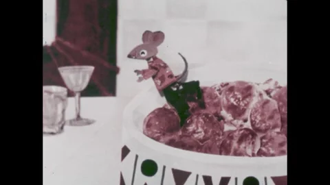 1960s: Mouse jumps out of bowl of biscui... | Stock Video | Pond5