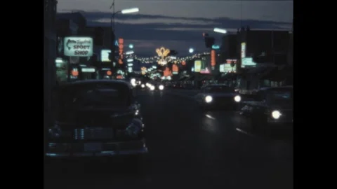 1960s: Neon signs along the city street,... | Stock Video | Pond5