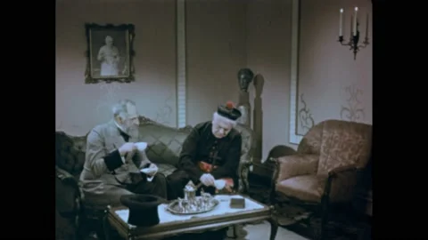 1960s: Parlor. Priest and man sit. Men... | Stock Video | Pond5