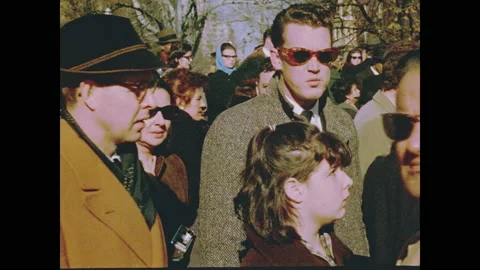 1960s: People in crowd watch funeral pro... | Stock Video | Pond5