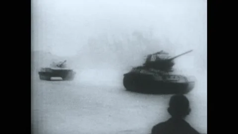 1960s: People run from tanks. The buildi... | Stock Video | Pond5