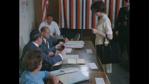 1960s: People at table by voting booth, ... | Stock Video | Pond5