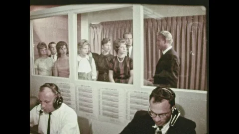 1960s: People talking behind glass in co... | Stock Video | Pond5