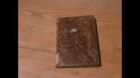 1960s: A person flips through pages of a... | Stock Video | Pond5