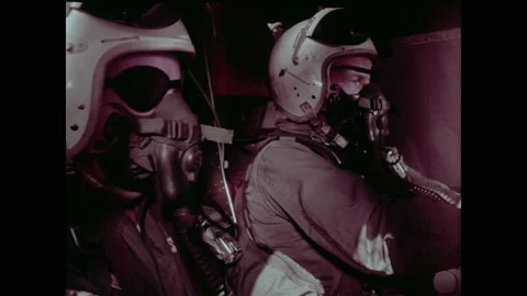 1960s: A pilot and co-pilot, both wearin... | Stock Video | Pond5