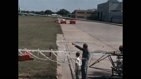 1960s: Pilot showing boy around the heli... | Stock Video | Pond5