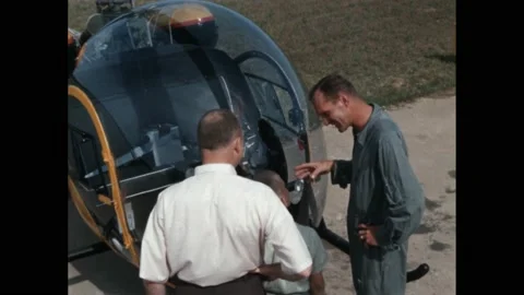 1960s: Pilot talking to man and boy in f... | Stock Video | Pond5