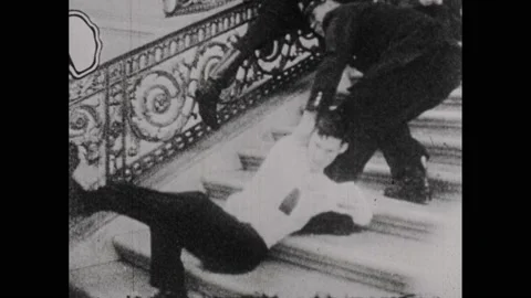 1960s: Police drag people down the stair... | Stock Video | Pond5